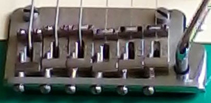 The joy of flatwound strings on a solid body bridge